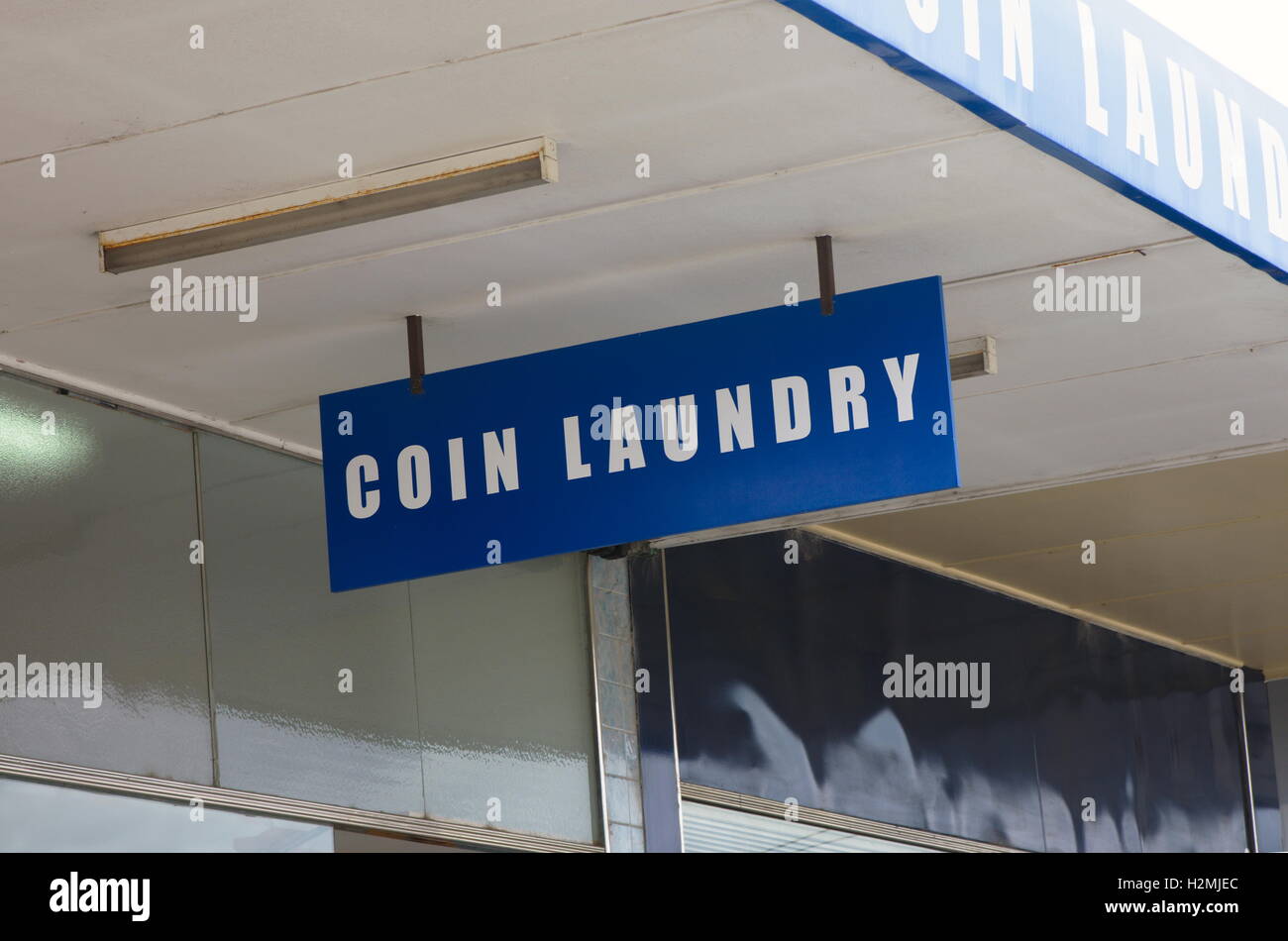 coin laundry sign Stock Photo - Alamy