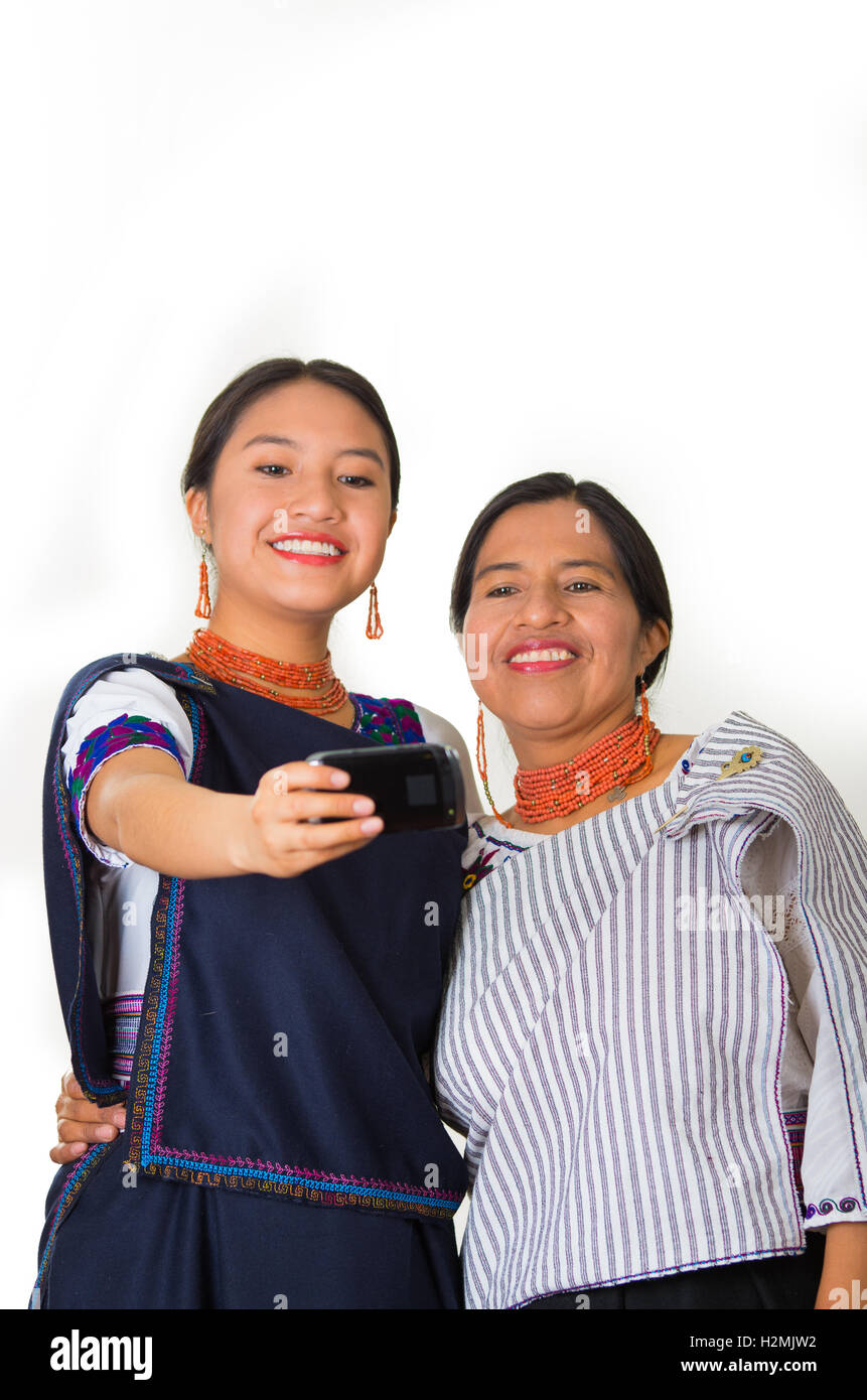 Beautiful hispanic mother and daughter wearing traditional andean ... Beautiful hispanic mother and daughter wearing traditional andean ...