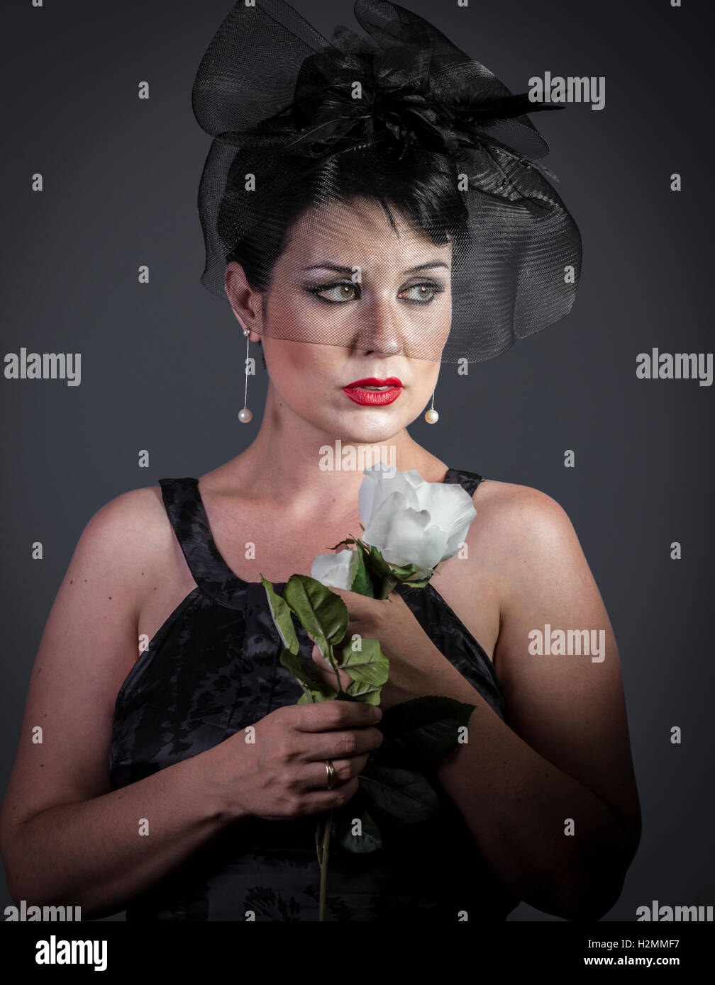 lonely.Widow At Funeral. Beautiful retro woman Stock Photo - Alamy