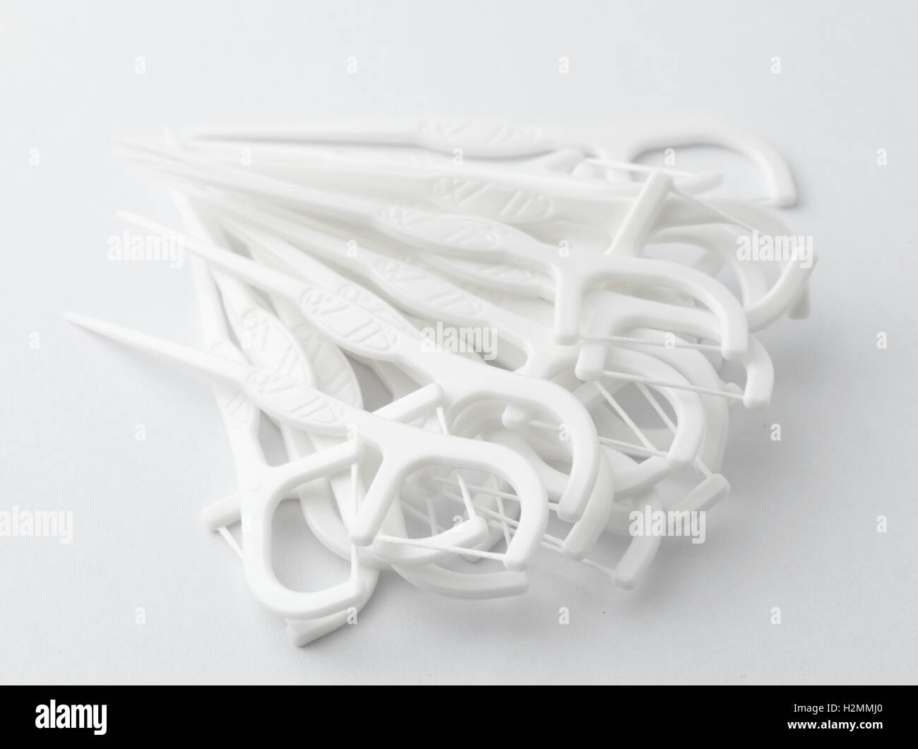 Plastic dental floss pick hi-res stock photography and images - Alamy