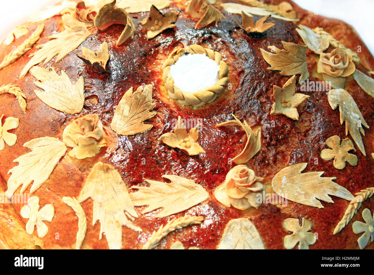 beautiful round loaf with floral pattern of flowers, leaves and salt ...