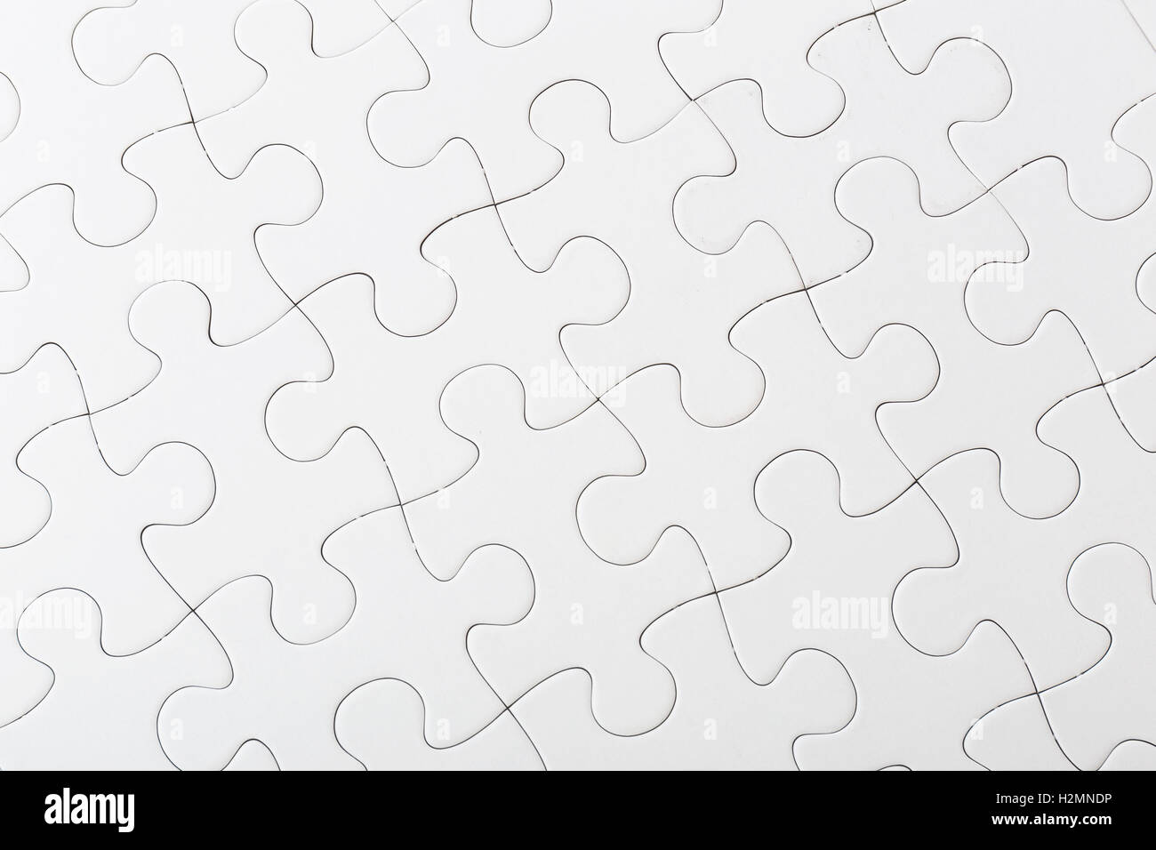 Completed white puzzle Stock Photo - Alamy