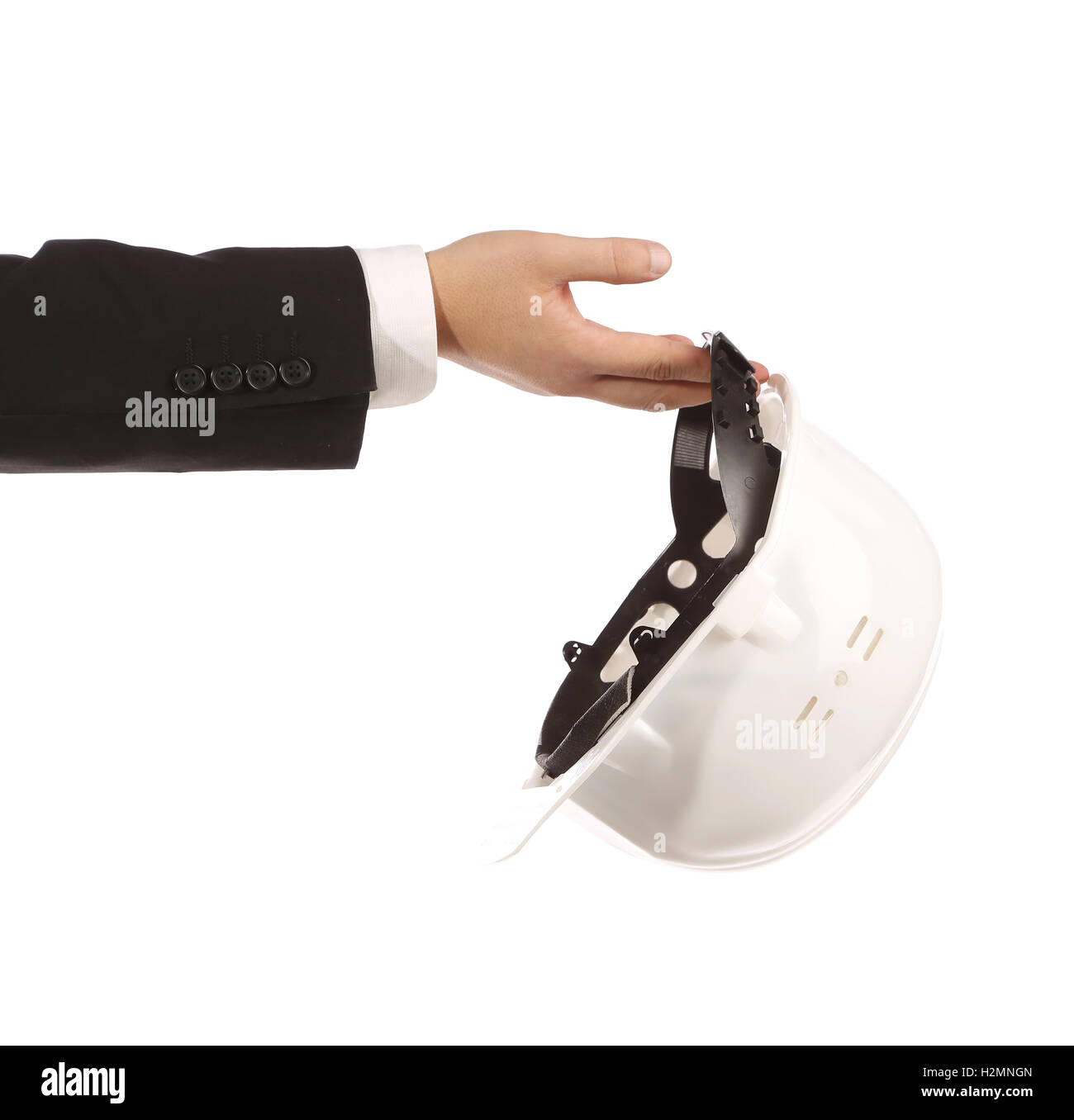 Hand holding out the construction white helmet Stock Photo - Alamy