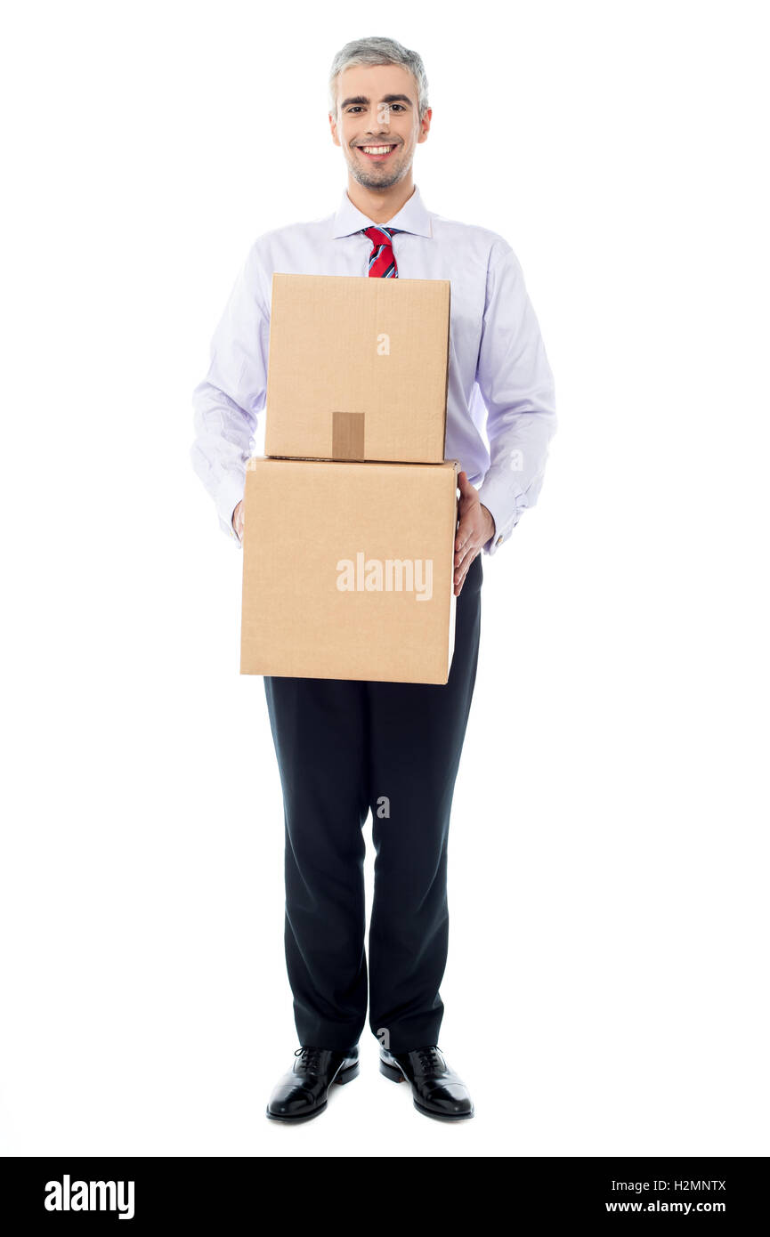 Handsome male with with stack of boxes Stock Photo - Alamy