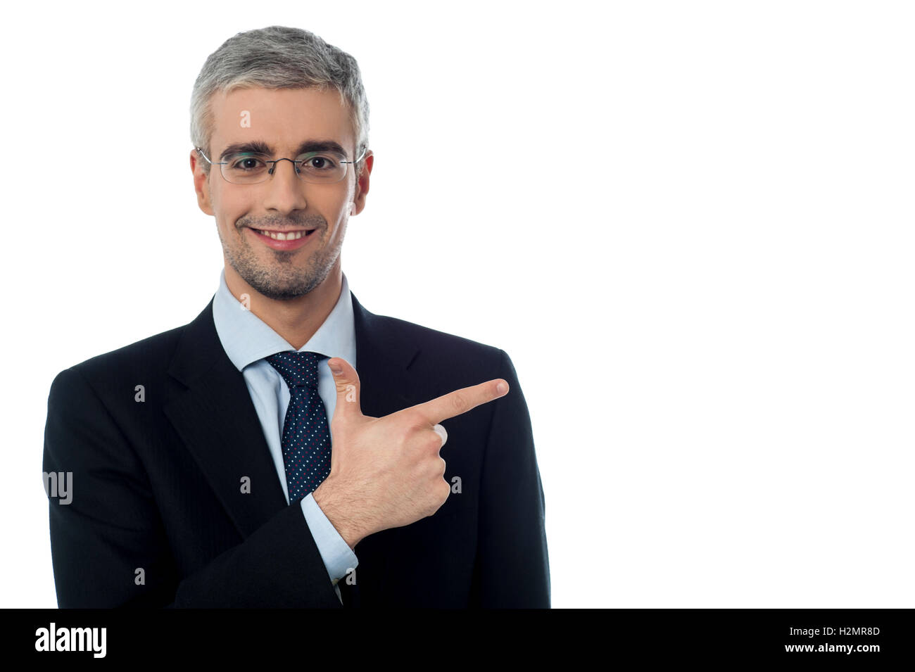 Businessman pointing at something Stock Photo - Alamy