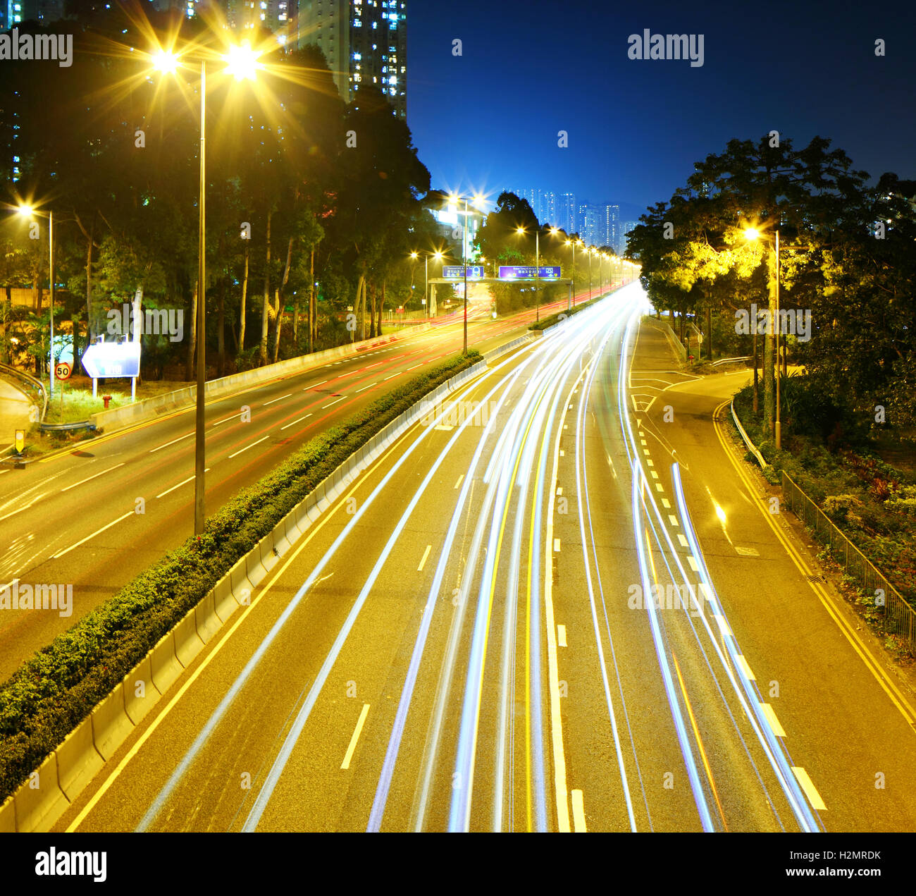 Highway with traffic trail at night Stock Photo - Alamy