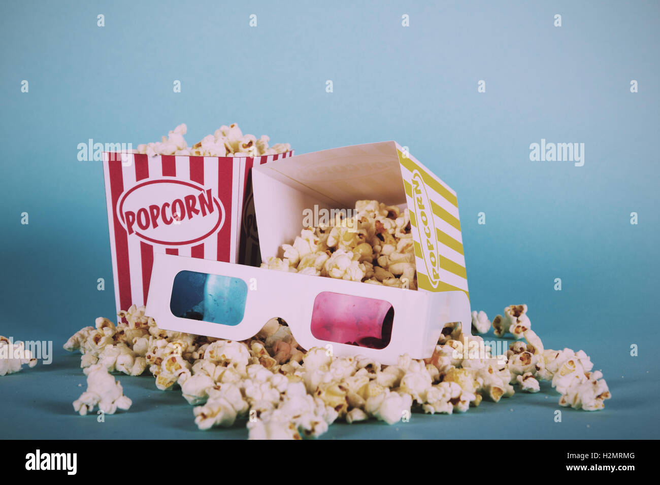 Bucket of popcorn against a blue background Vintage Retro Filter Stock ...