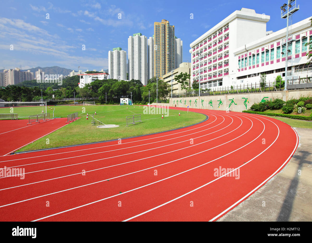 Sport running track in stadium Stock Photo - Alamy