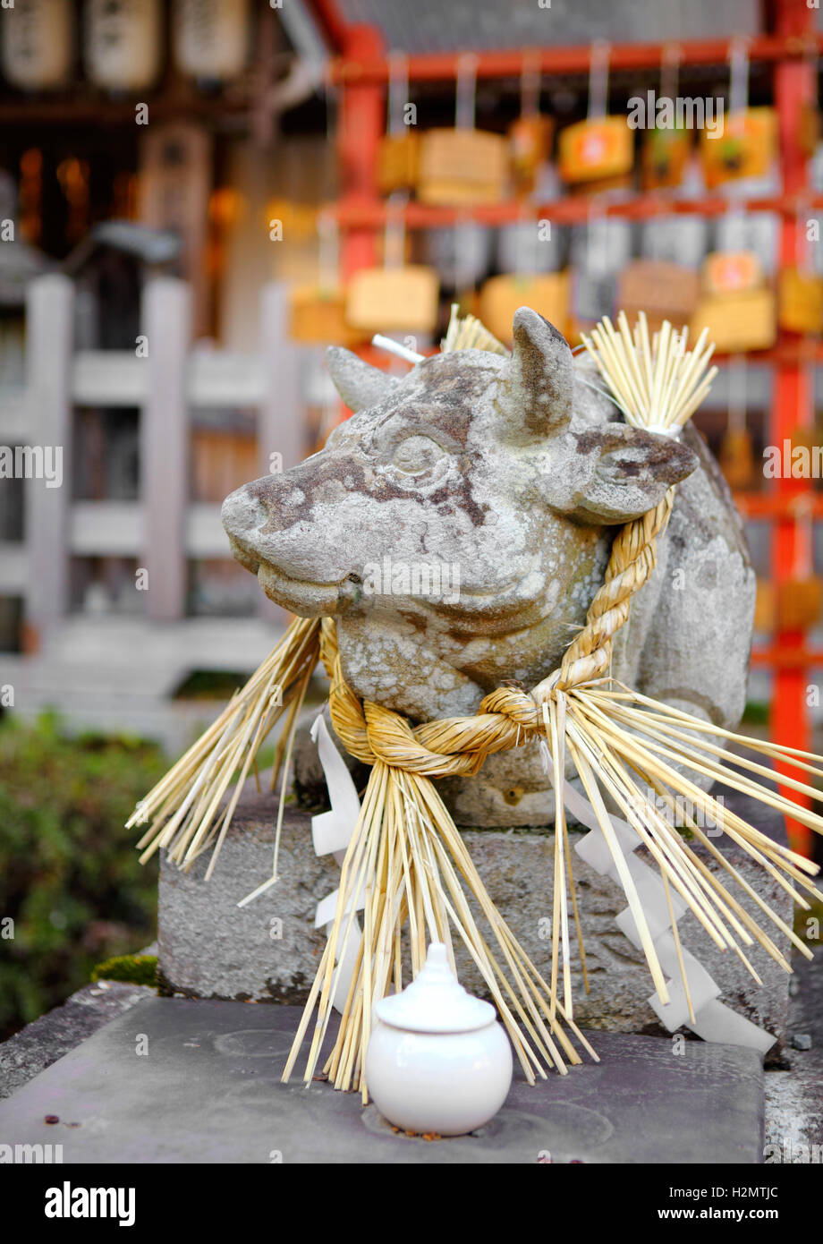 Stone cow statue in Japanese temple Stock Photo - Alamy