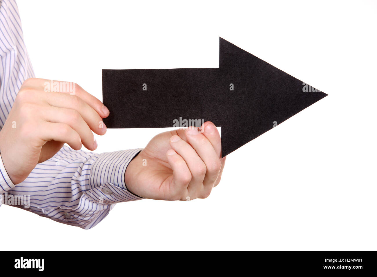 Person hold Black Arrow shape Stock Photo - Alamy