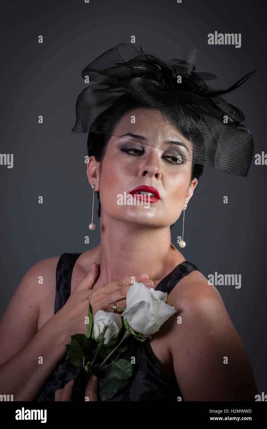 alone. Widow At Funeral. Beautiful retro woman Stock Photo - Alamy