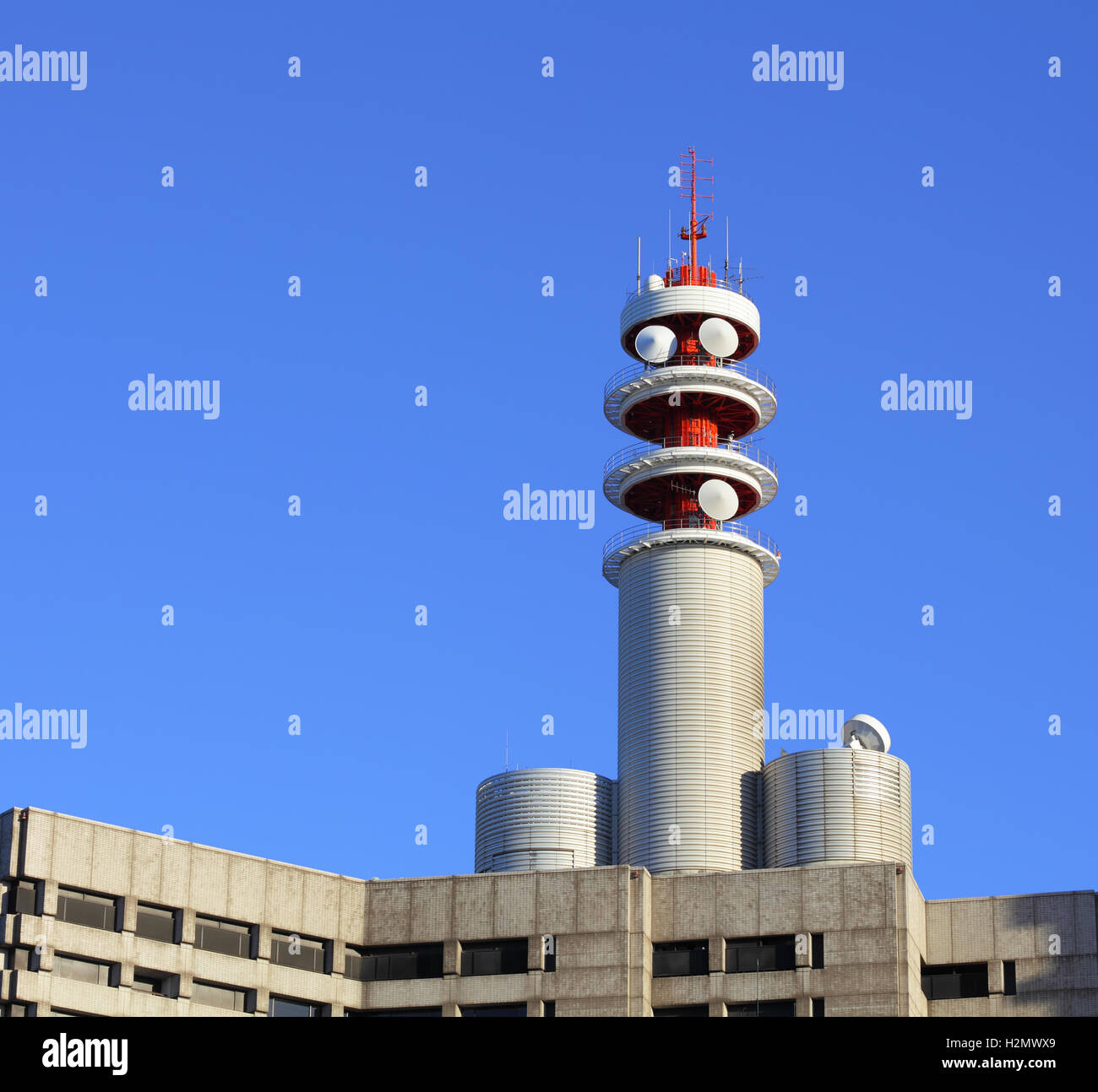 Broadcast tower on building Stock Photo - Alamy