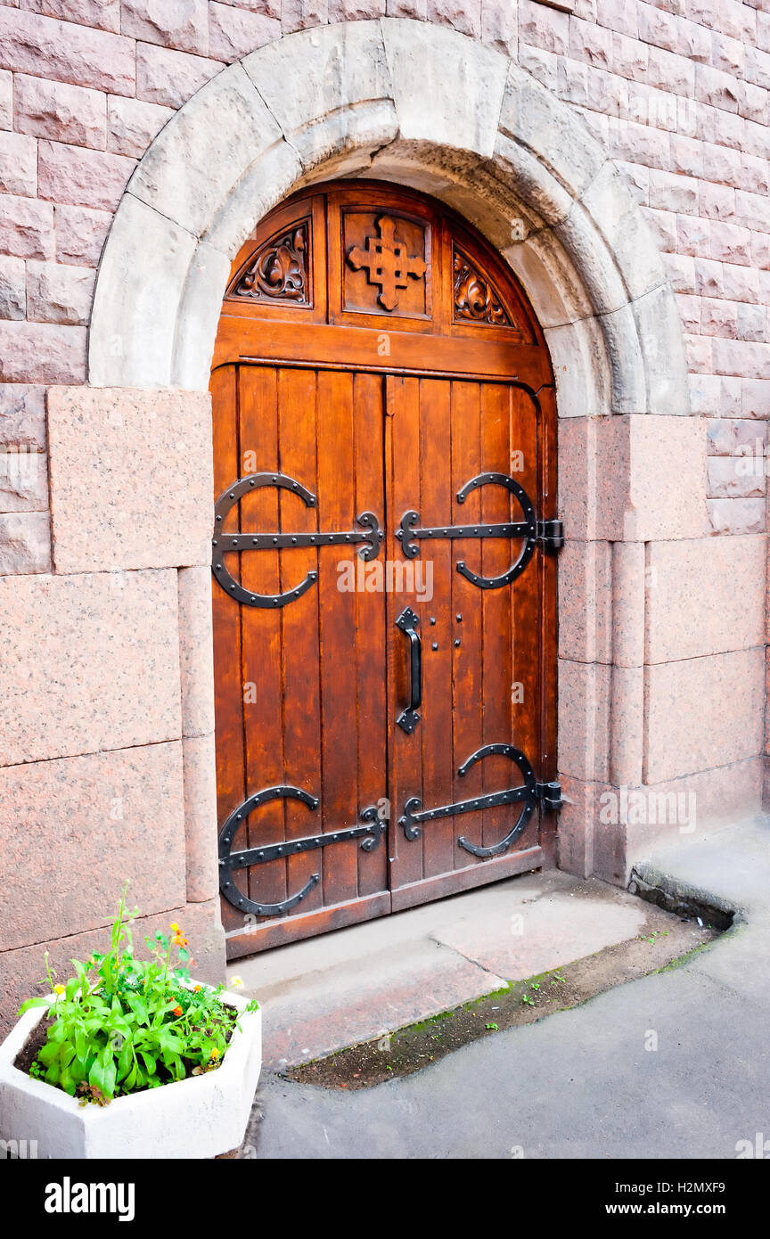 wooden medieval gate in the stone wall of the castle Stock Photo - Alamy