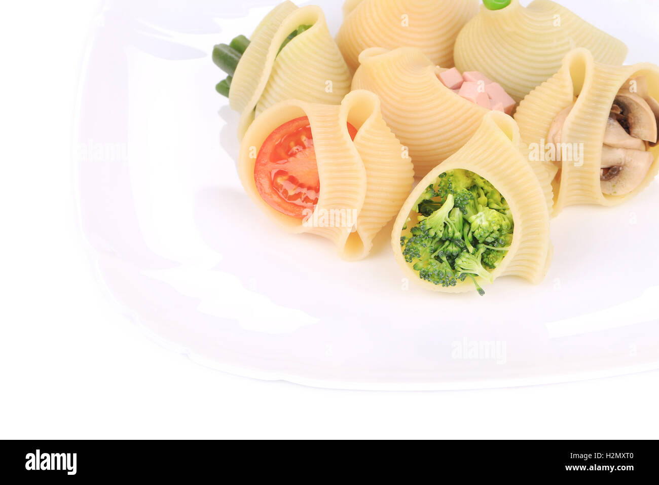 Stuffed pasta shells with broccoli and mushrooms Stock Photo - Alamy