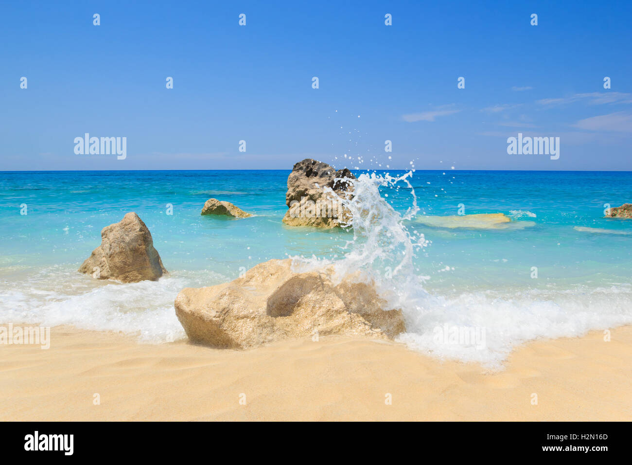 Sandy beach with stones in Kalamitsi Lefkas Greece Stock Photo - Alamy