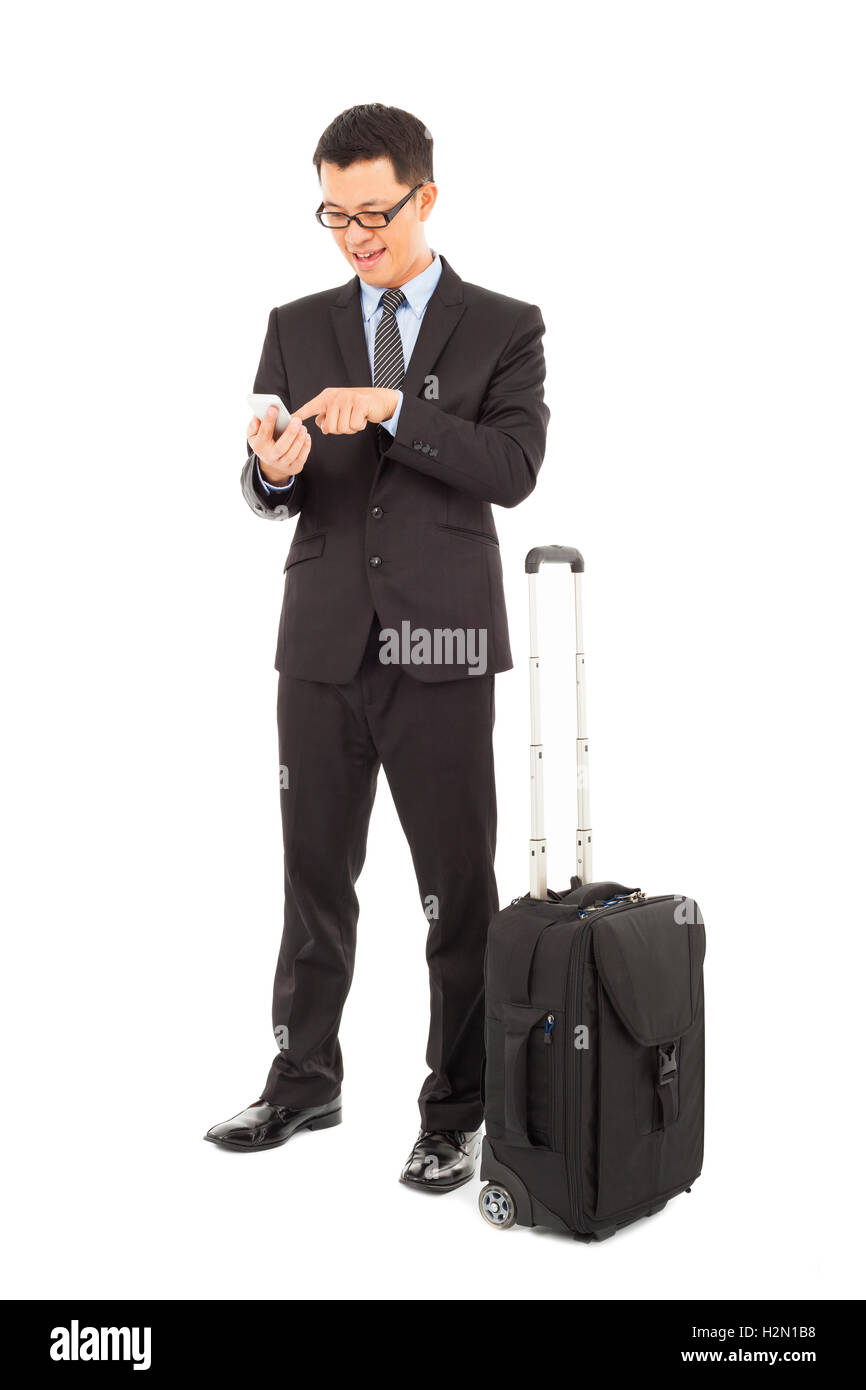 Young businessman using a cell phone with briefcase Stock Photo - Alamy