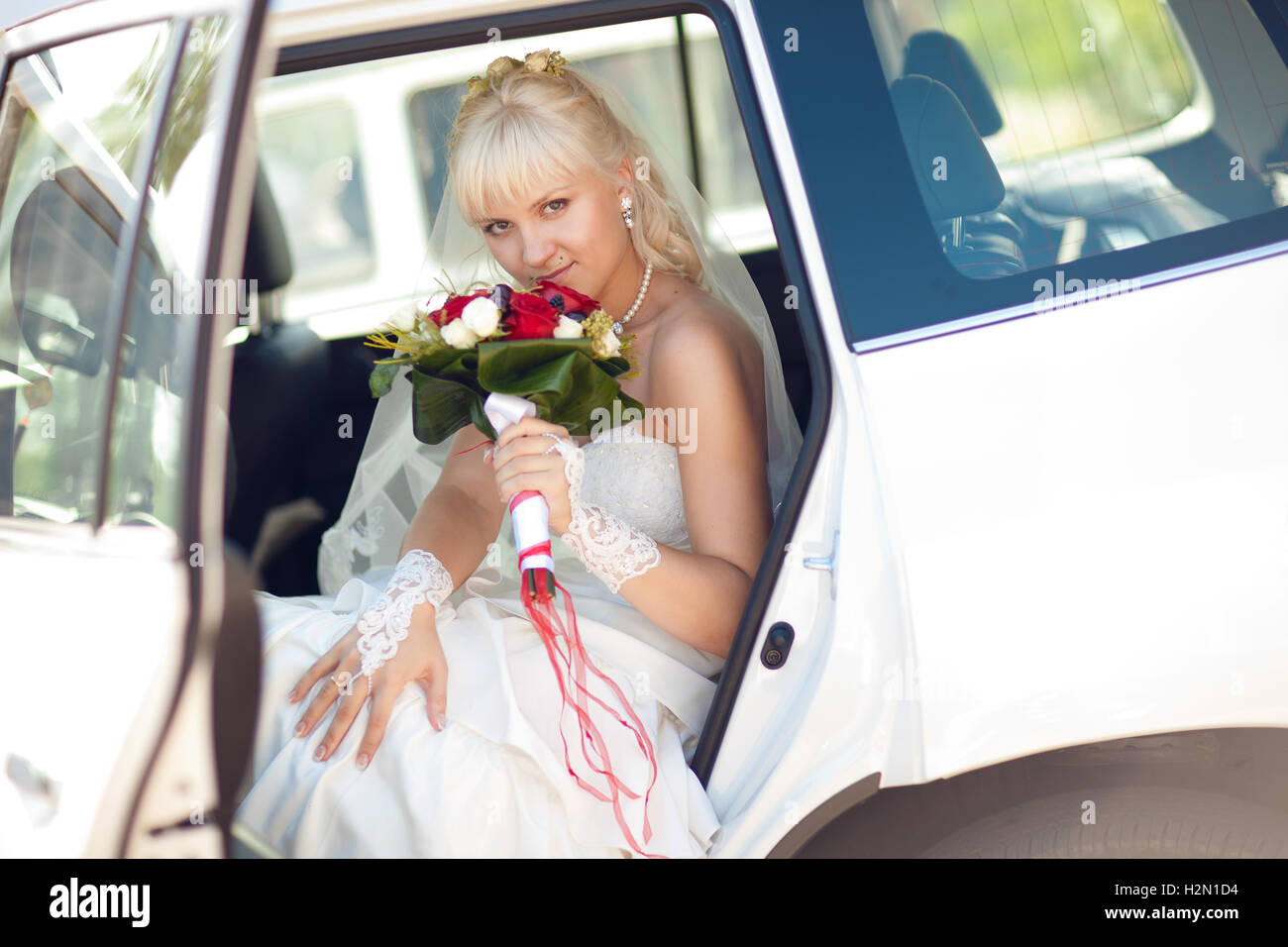 portrait of the bride in car Stock Photo - Alamy
