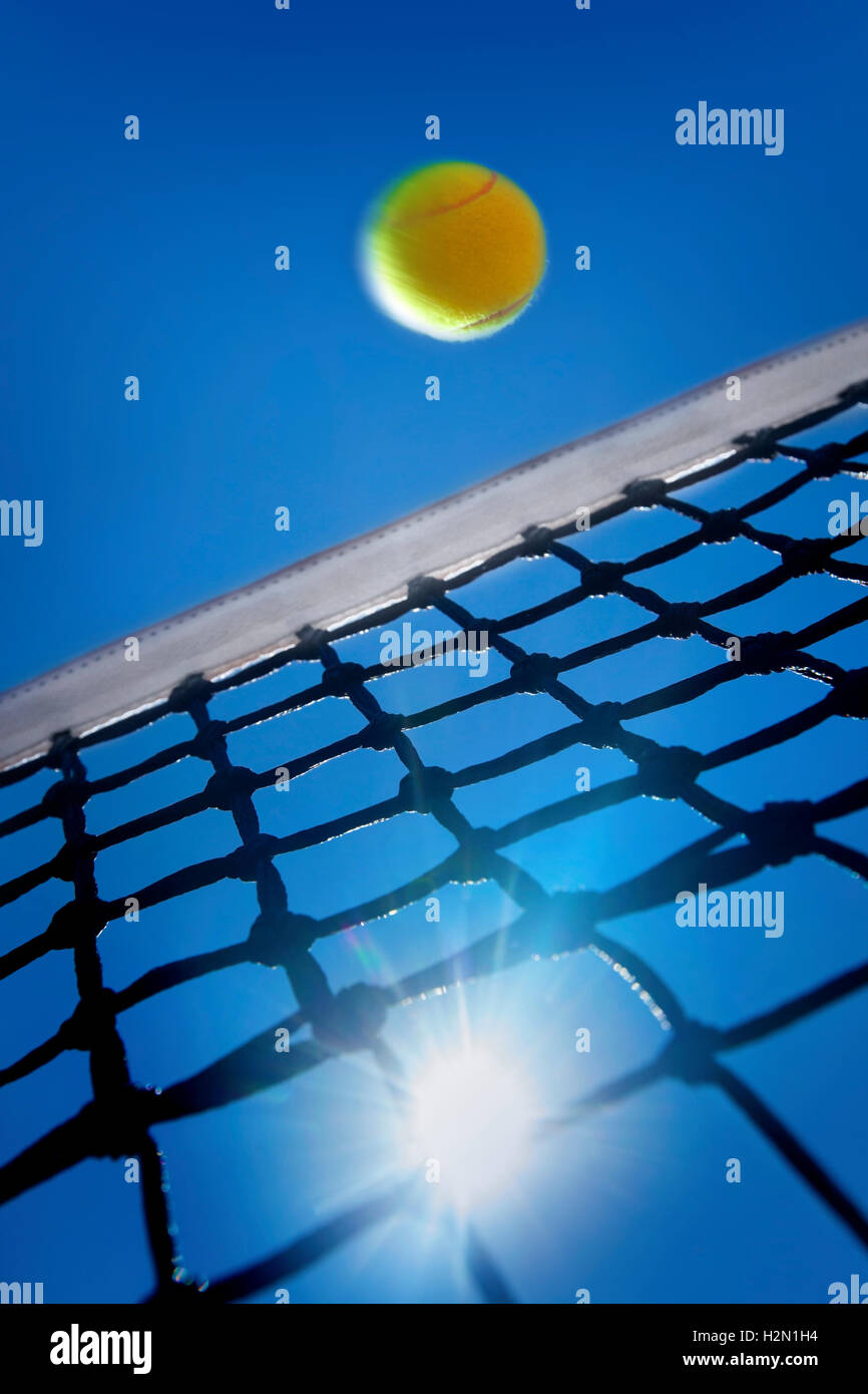 Tennis Ball over Net Stock Photo - Alamy