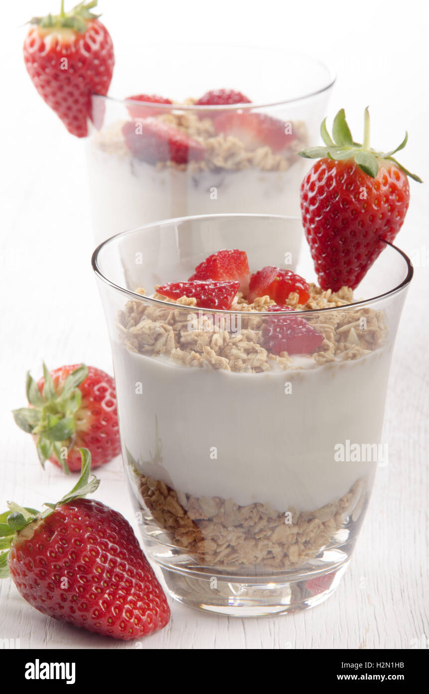 yogurt with crunchy cereal and strawberry Stock Photo - Alamy
