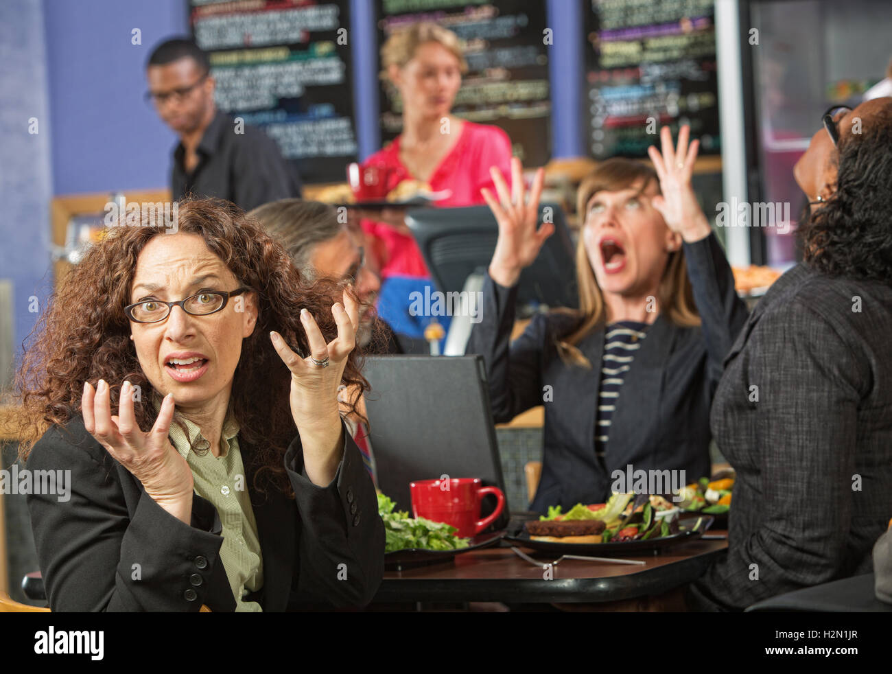 Embarrassed group in cafe hi-res stock photography and images - Alamy