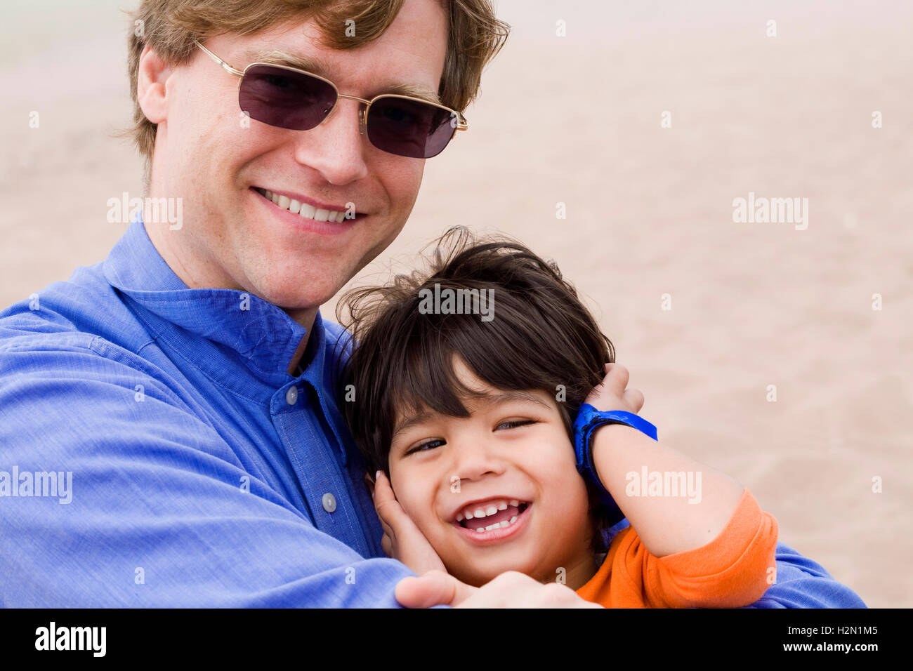 Father and son laughing together Stock Photo - Alamy
