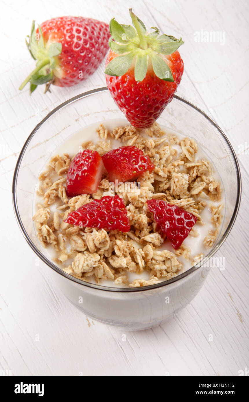 yogurt with crunchy cereal and strawberry Stock Photo - Alamy