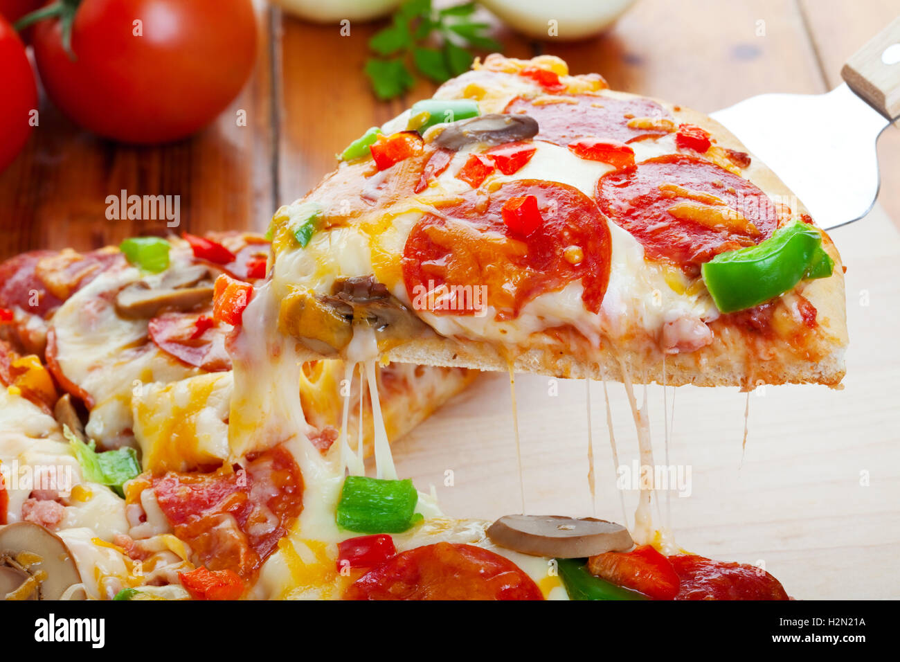Stringy cheese pizza hi-res stock photography and images - Alamy