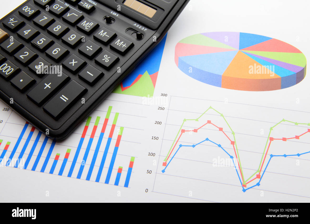 Data chart with calculator Stock Photo - Alamy