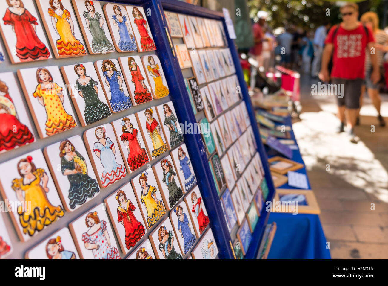 Market selling art items, paintings, photographs, fans, decorative ...