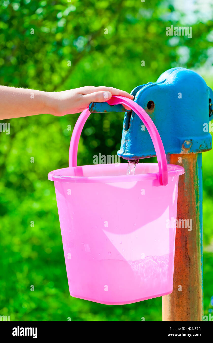 Bucket of water hand hi-res stock photography and images - Alamy
