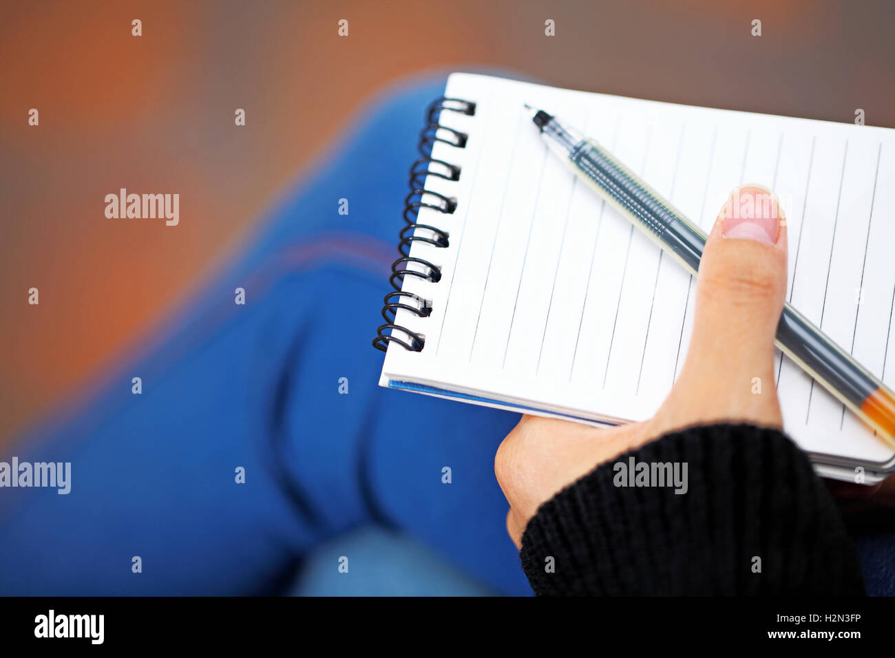 Notepad hold by hand Stock Photo - Alamy