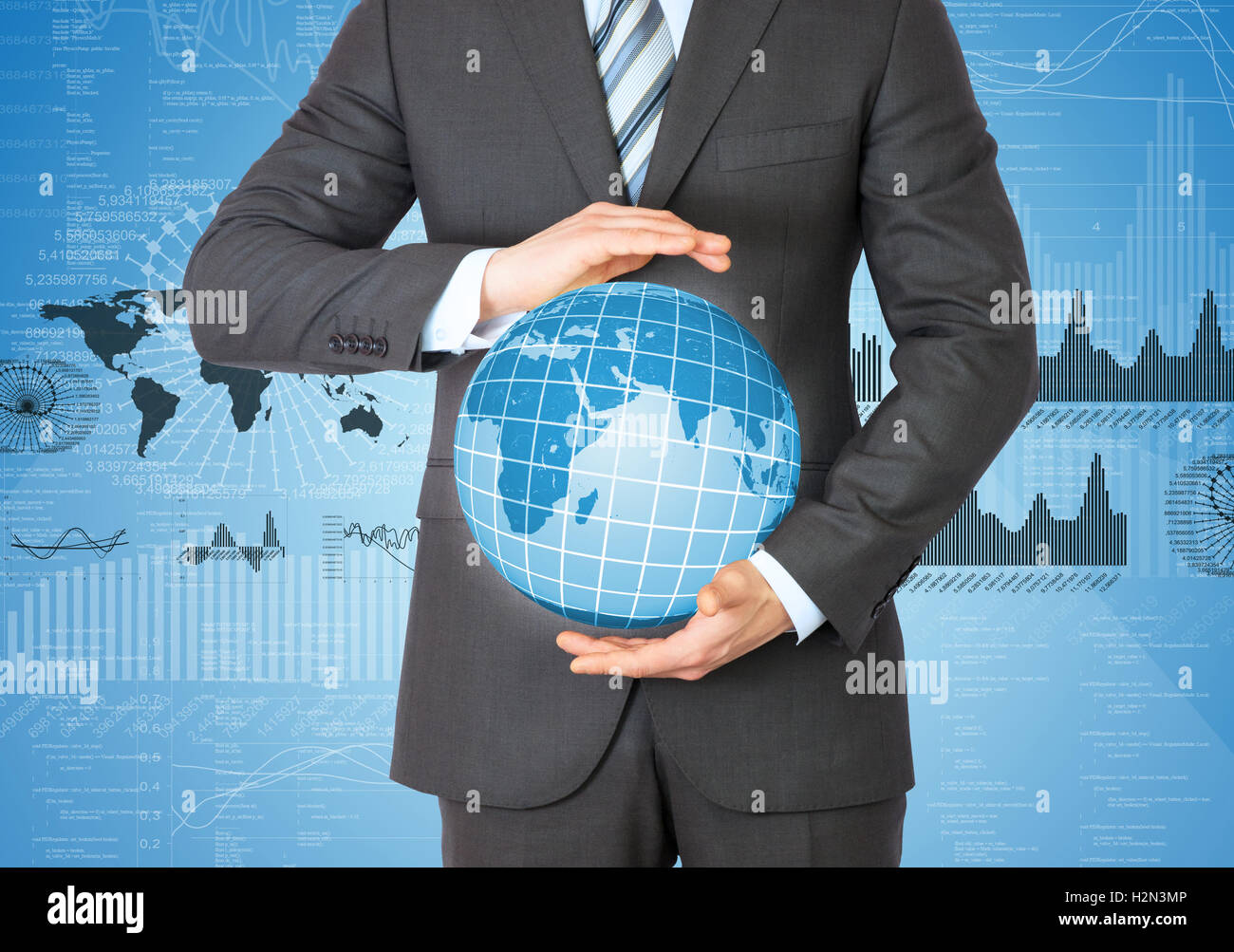 Businessman in a suit holding a globe Stock Photo - Alamy