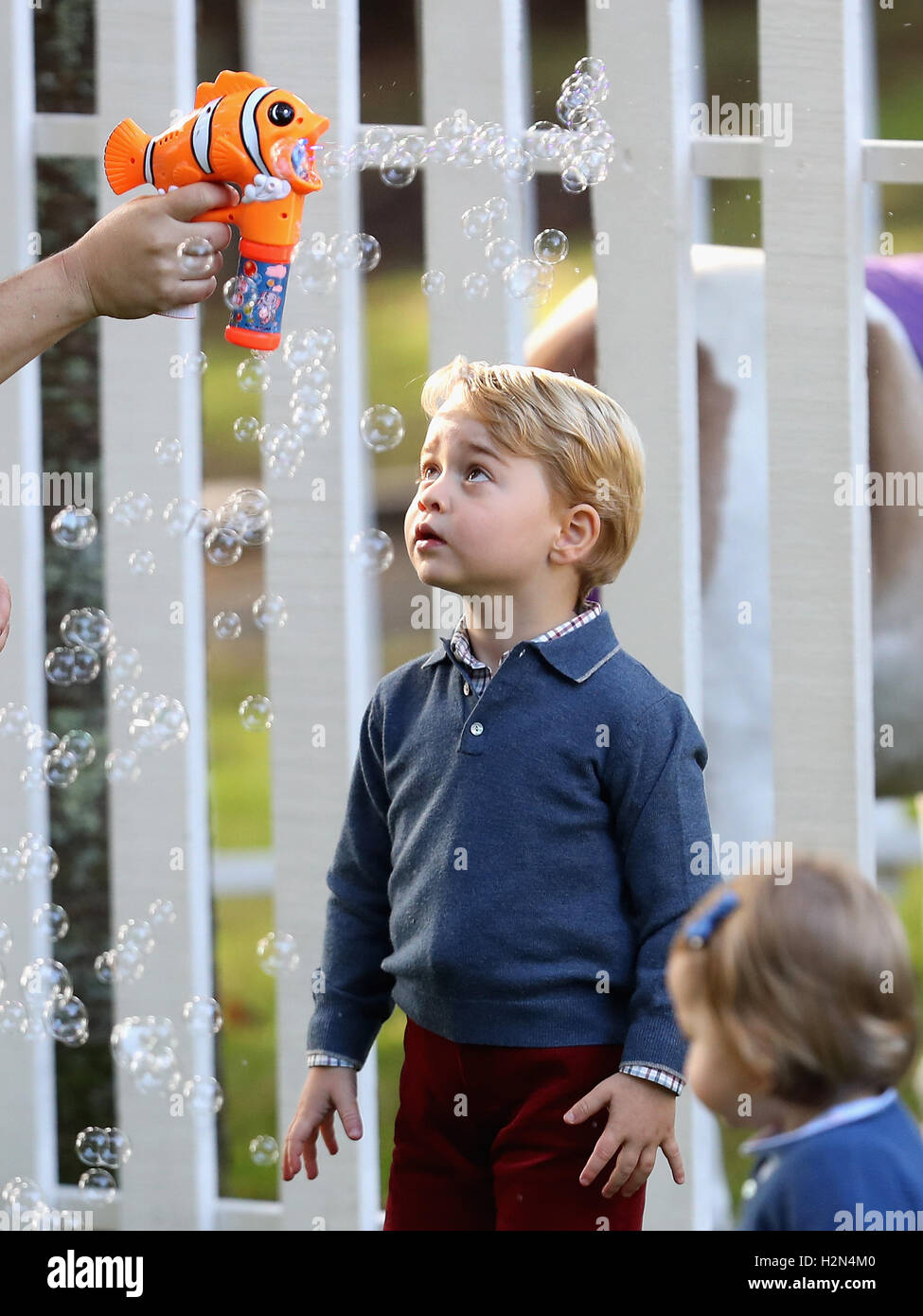 Prince George plays with bubbles at a children's party for Military ...
