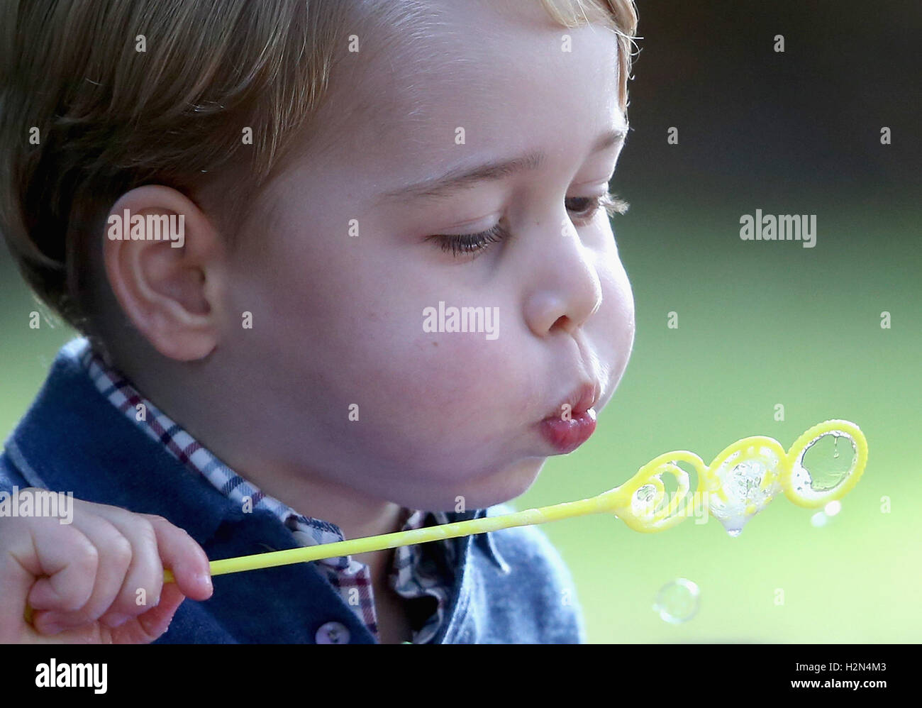Prince George plays with bubbles at a children's party for Military ...