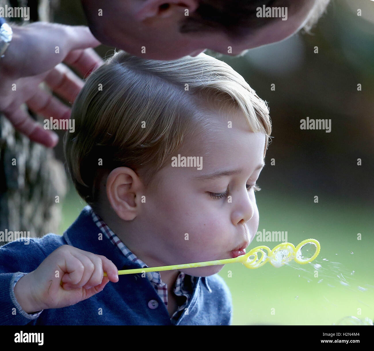 Prince George plays with bubbles at a children's party for Military ...