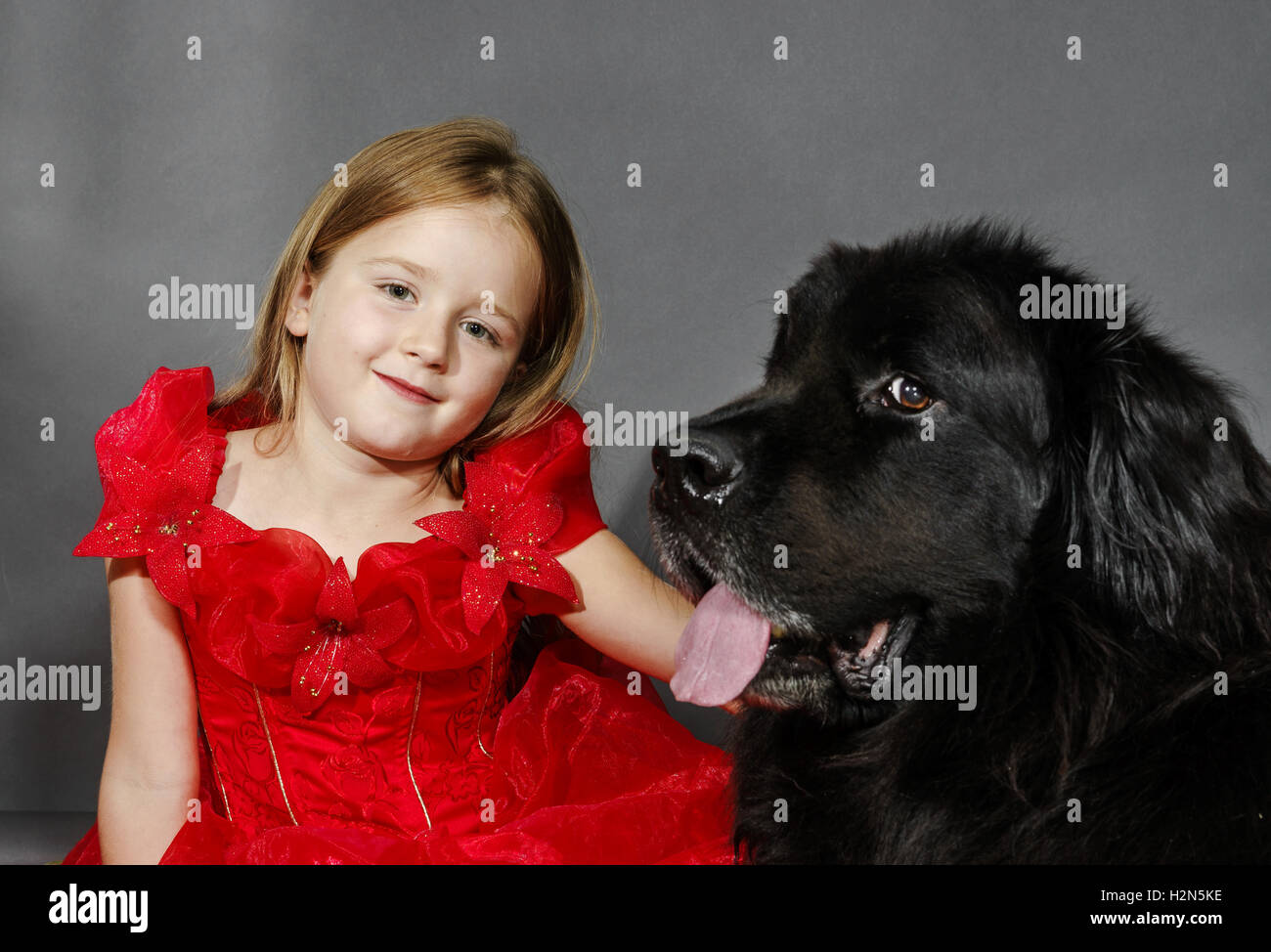 Beauty and the Beast. Little girl with big black water-dog portrait ...