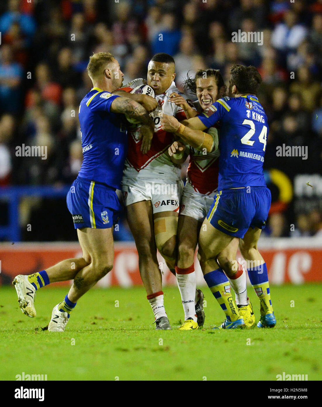 Warrington Wolves' Joe Westerman (left) and Toby King (right) tackle St ...