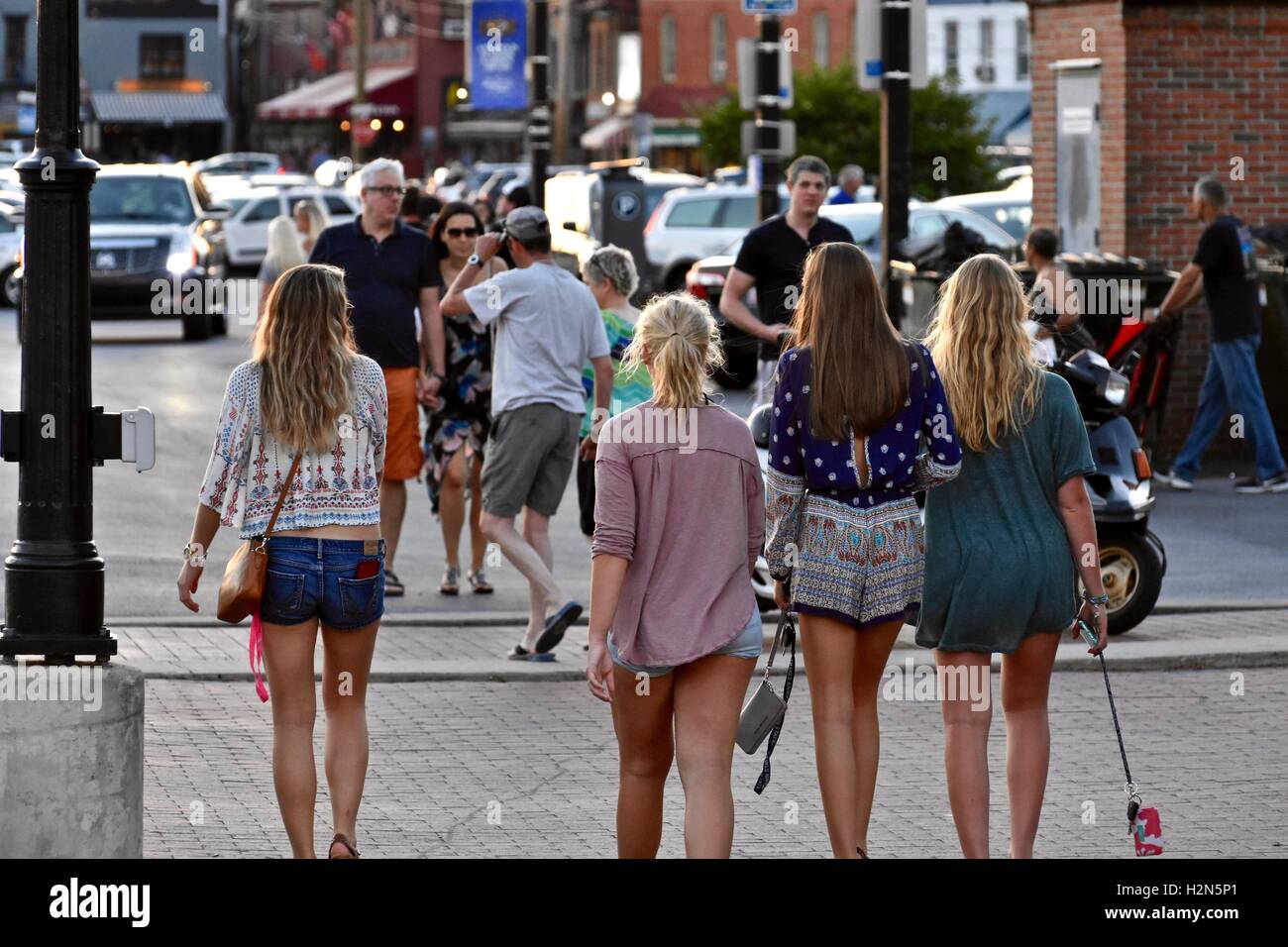 A group of girls walking down the street Stock Photo - Alamy