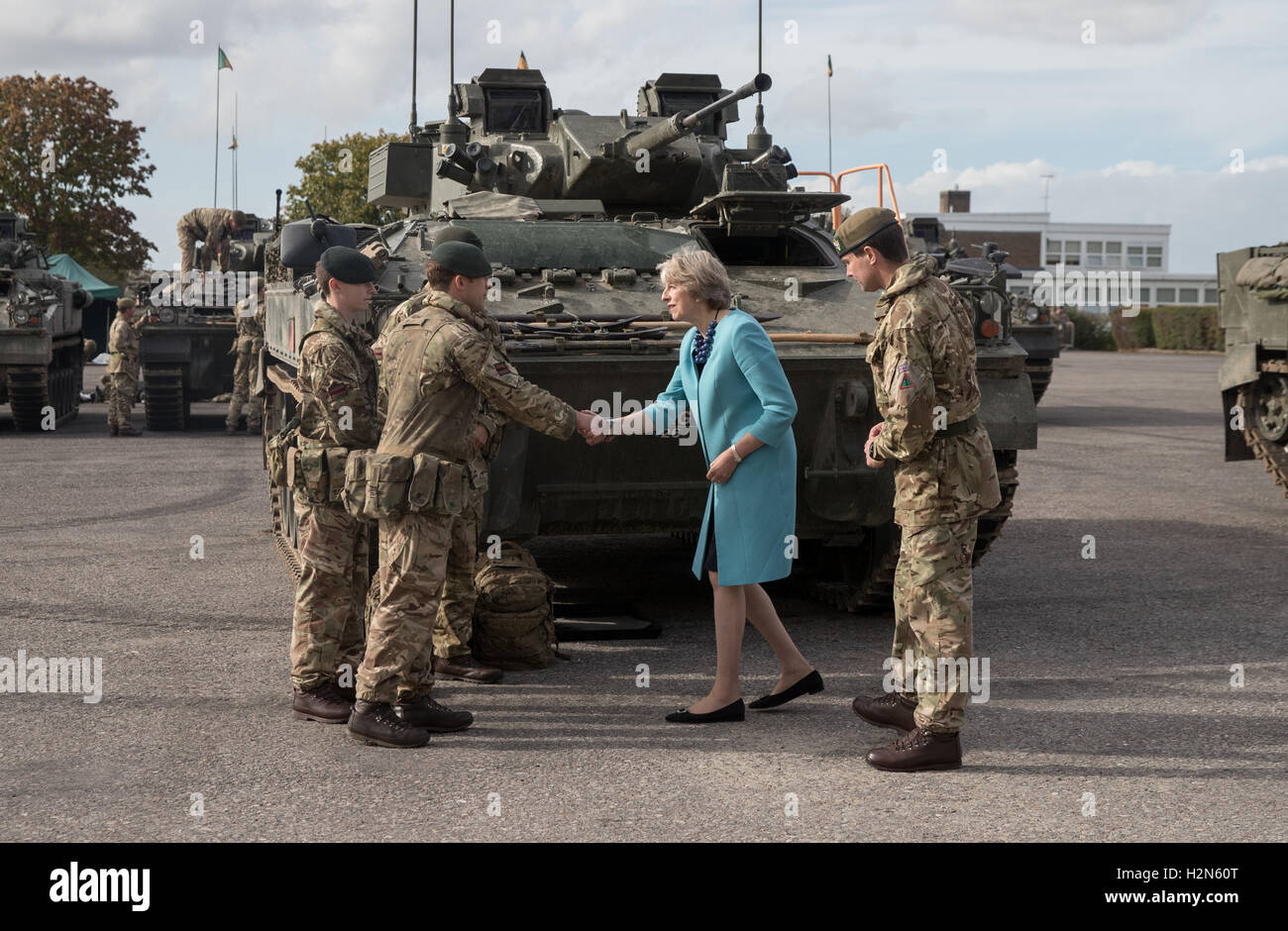 Prime Minister Theresa May greets troops as she visits 1st Battalion ...