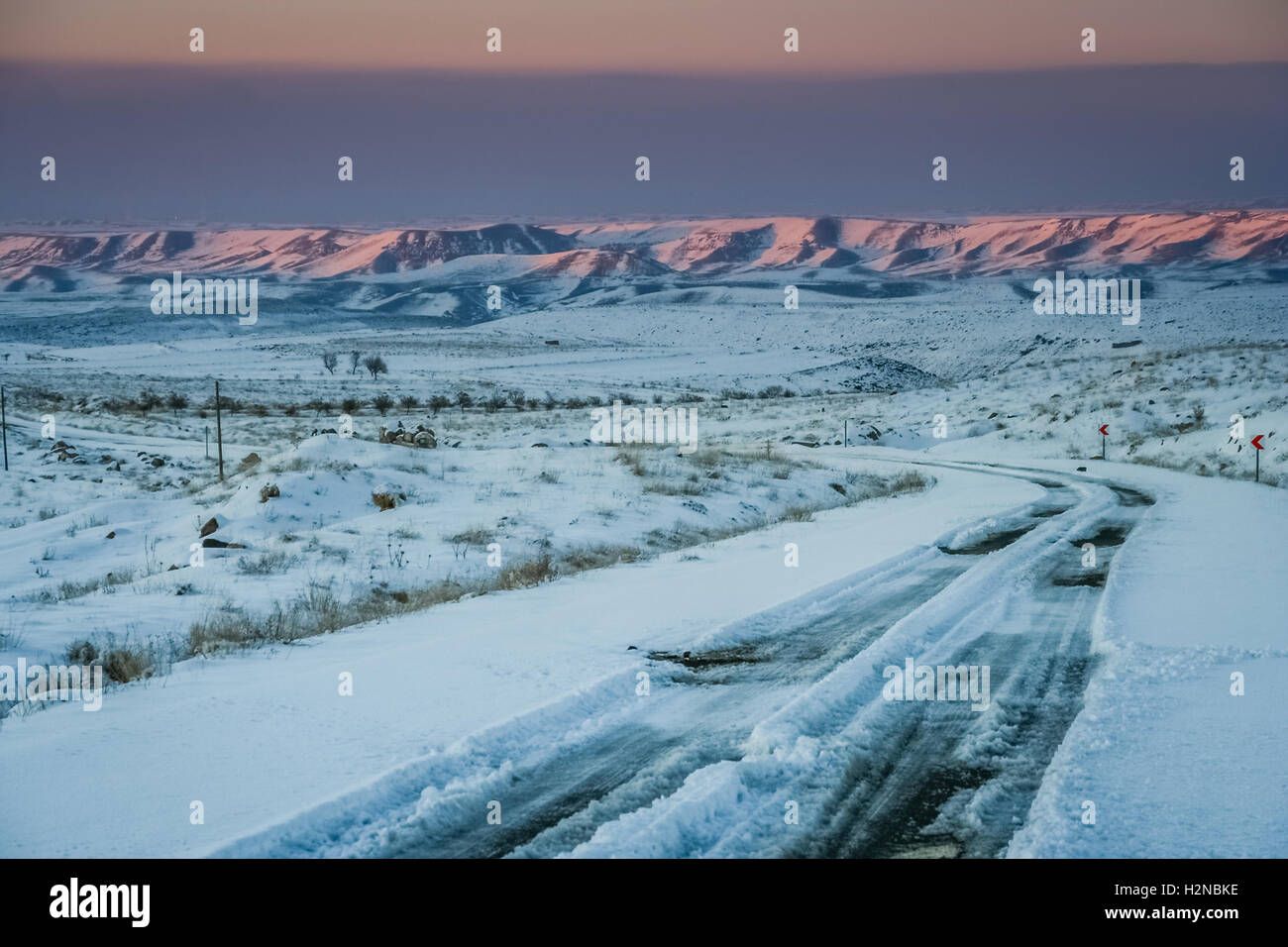 Covered in snow road through the mountains in the northern Iran between ...