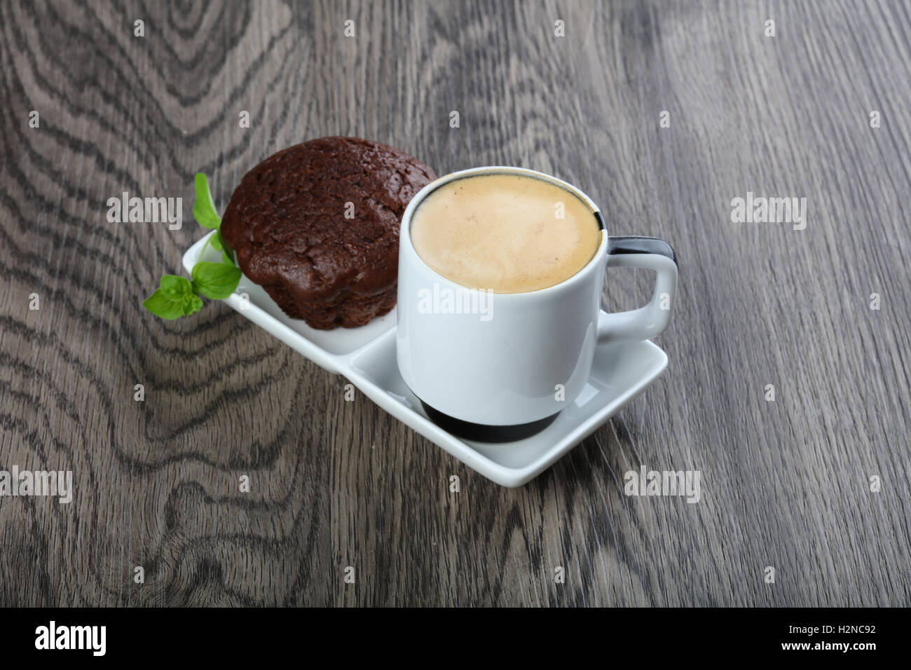 Coffee with muffin on the wood background Stock Photo - Alamy