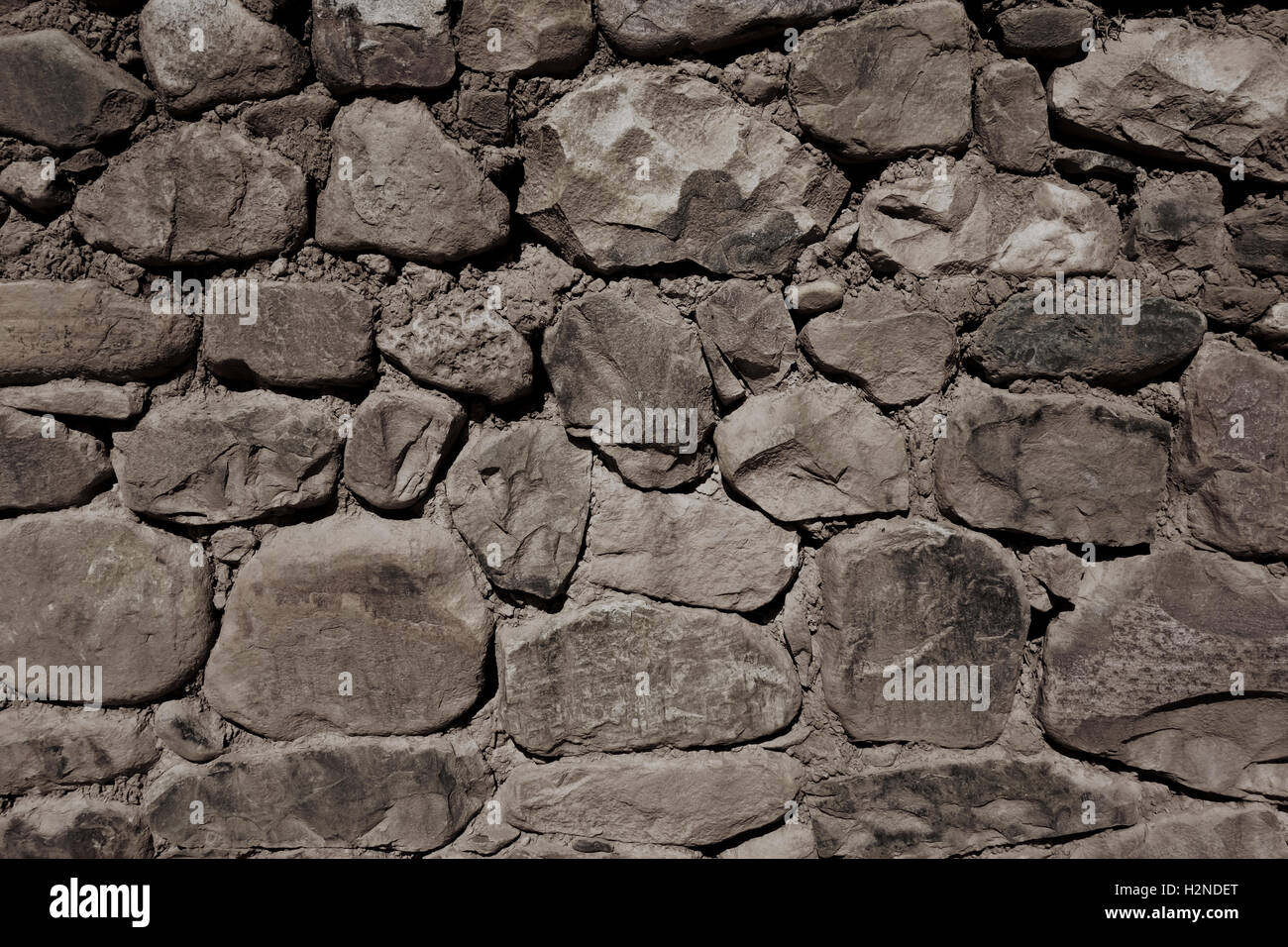Old rough stone wall, background wallpaper Stock Photo - Alamy