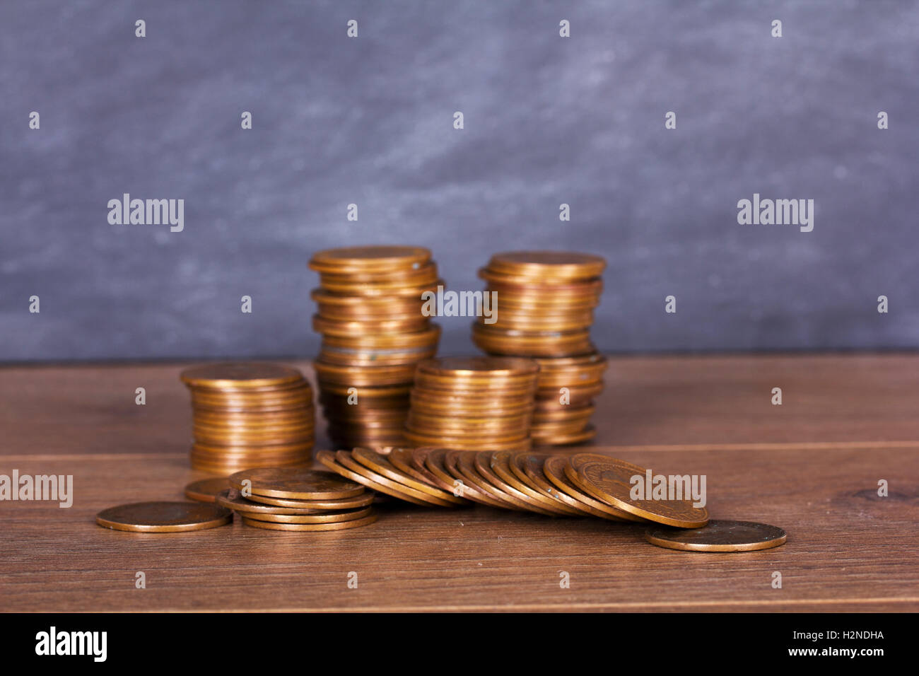 Stack of old penny coins on a wooden surface Stock Photo - Alamy