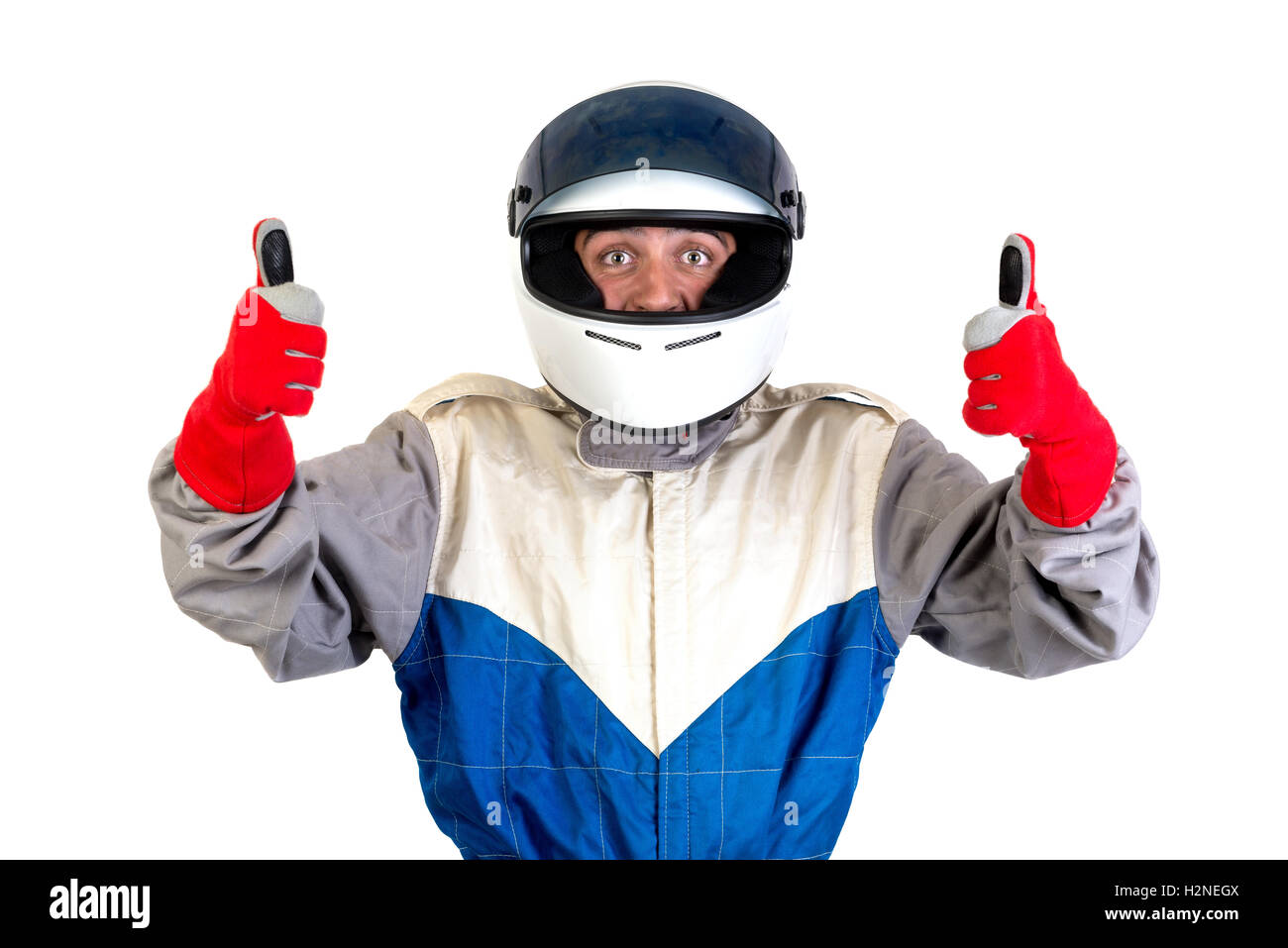 Racing driver posing with helmet isolated in white Stock Photo - Alamy