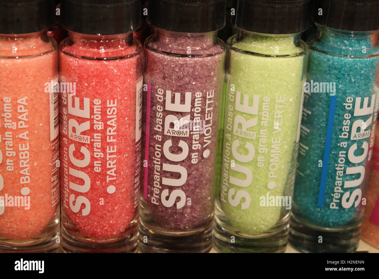 Five different colored sugars in a shop Stock Photo - Alamy