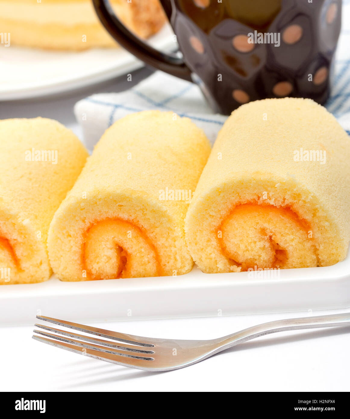 Orange Cake Meaning Swiss Rolls And Bakery Stock Photo - Alamy