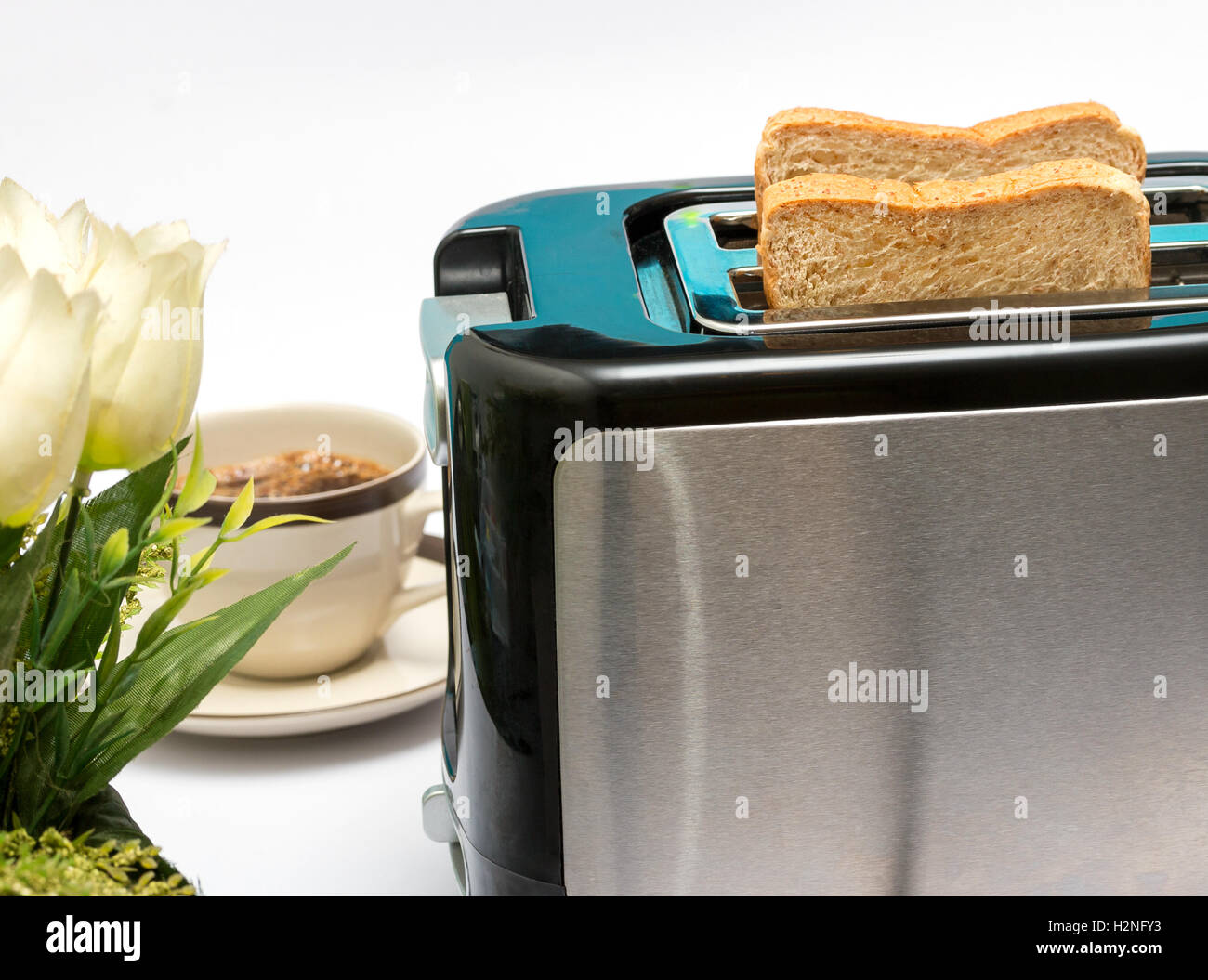 Bread In Toaster Showing Meal Time And Cooked Stock Photo - Alamy