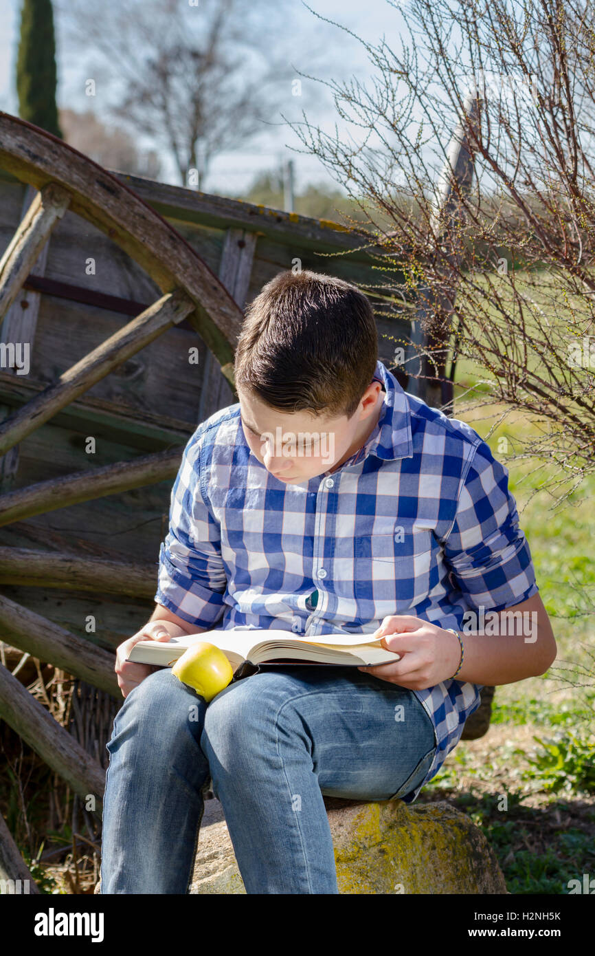 Cowboy young reading a book Stock Photo - Alamy