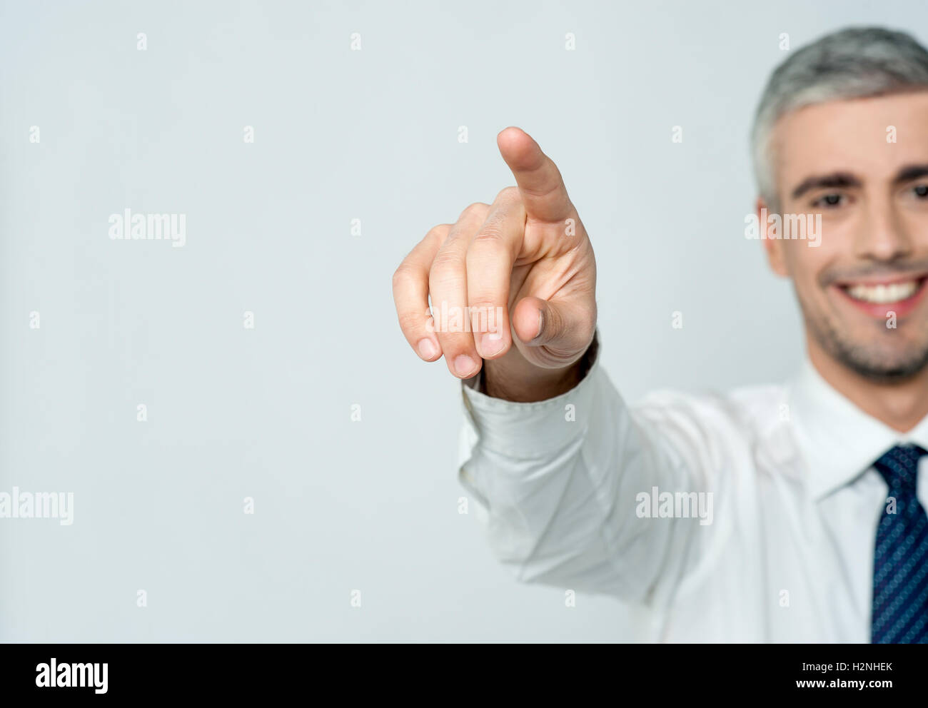 Business man pushing on a touch screen Stock Photo - Alamy