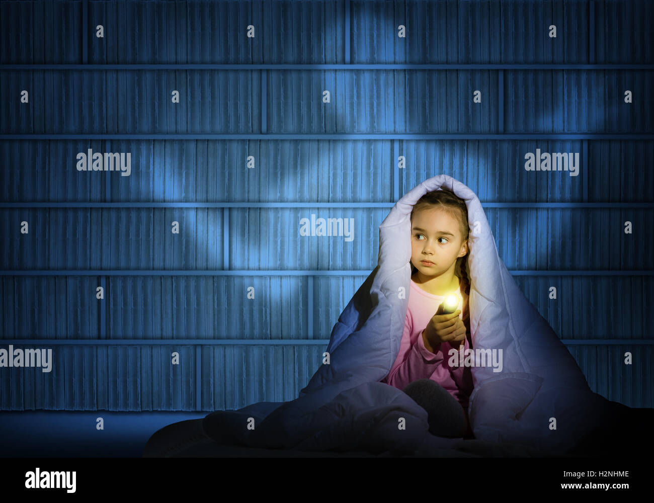 girl under the covers with a flashlight Stock Photo - Alamy